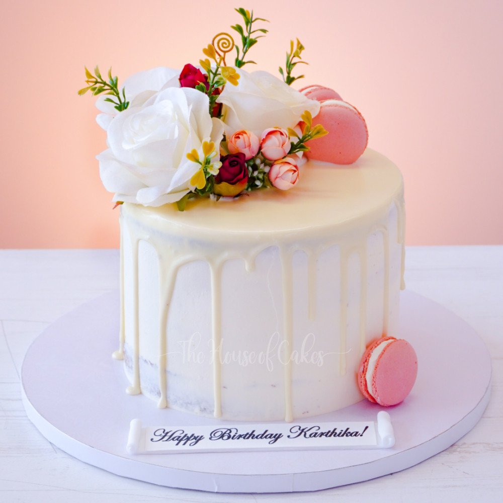 Exquisite Naked Dripping Cake with Roses in Dubai | The House of Cakes ...