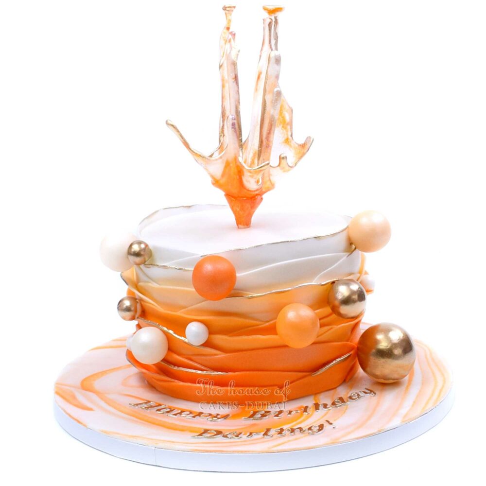 Elegant Orange Ombre Cake with Sail and Balls Design