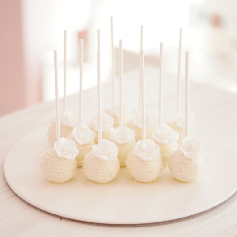 Pretty white cake pops with roses - The House of Cakes Dubai