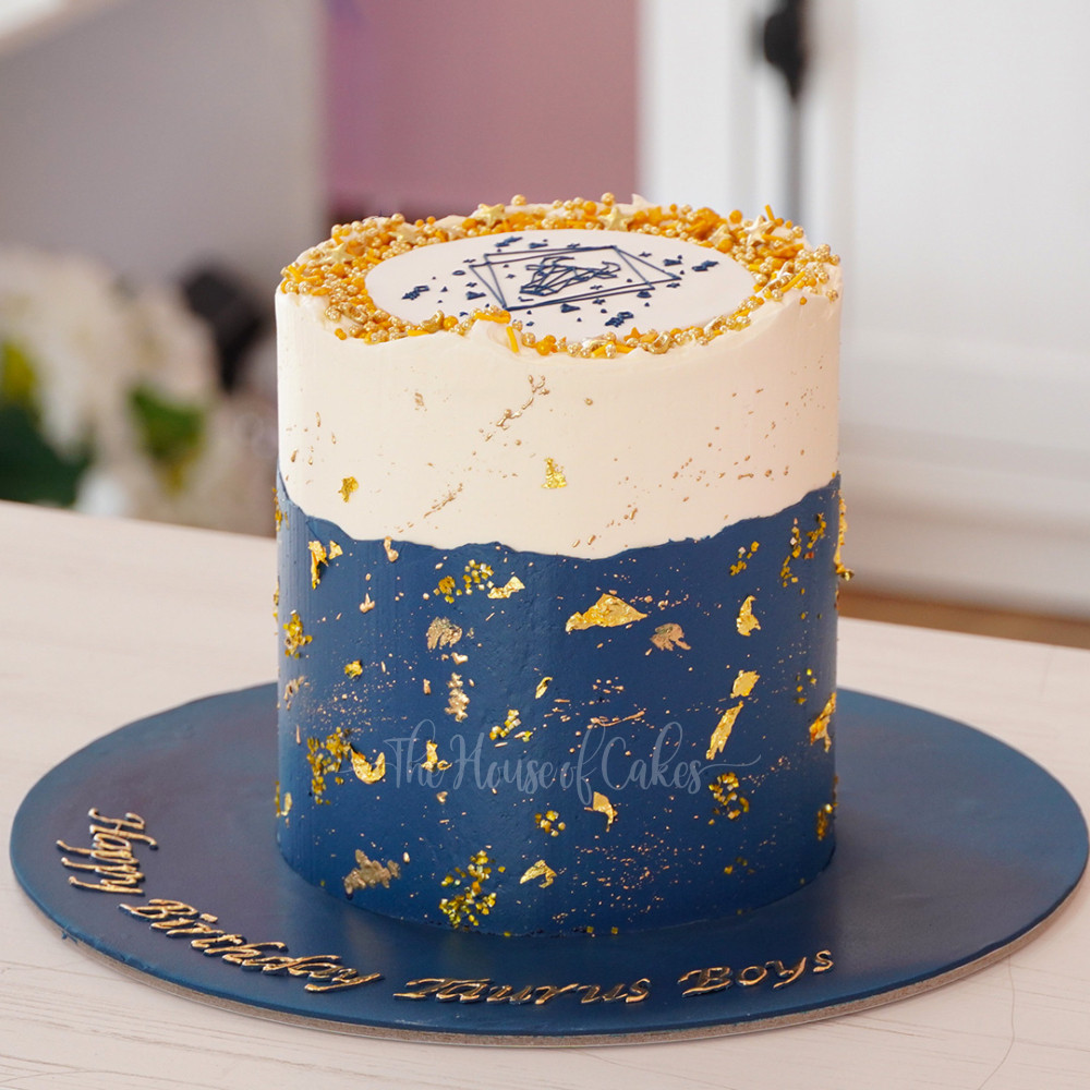Elegant White Blue and Gold Cake at The House of Cakes