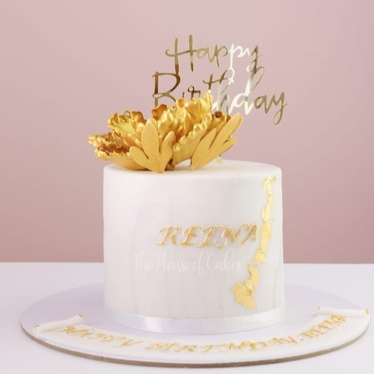 Decadent cake with gold flower - The House of Cakes Dubai