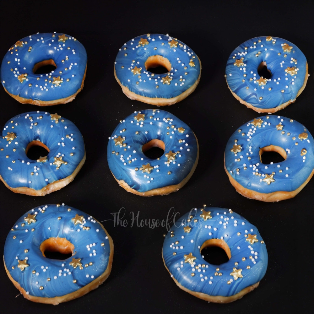 Elegant Blue Doughnuts with Gold Stars at The House of Cakes